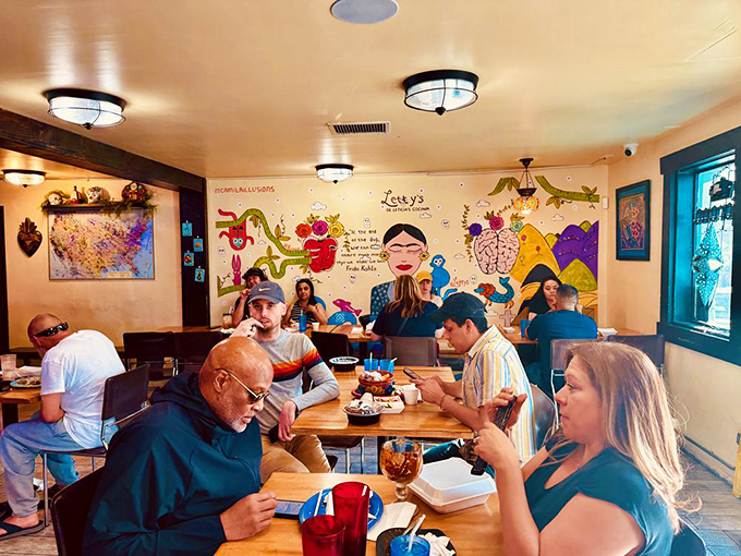 People don't stare at their phones here—they're too busy having religious experiences with their tacos. Note the focused expressions of culinary bliss.
