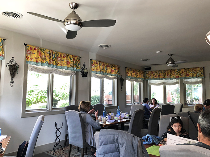 Bright windows and cheerful valances create a sunny disposition in this dining room, even on cloudy Colorado mornings.