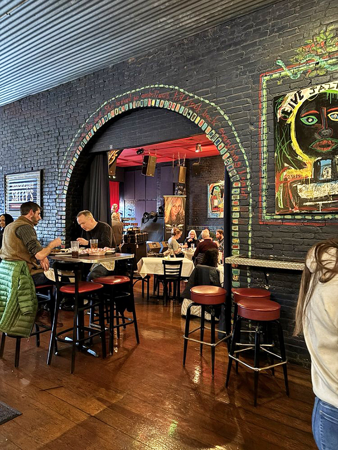 The dining room's archway, lined with playing cards, frames the experience like you're stepping into a Southern food fairytale.