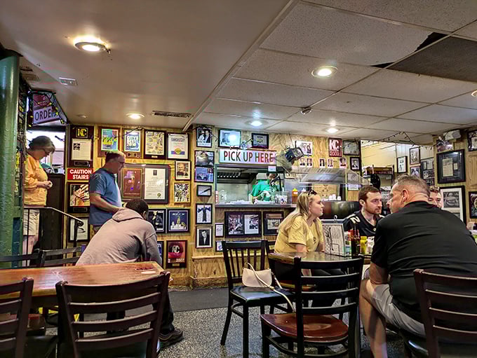 The bustling dining room hums with the universal language of burger appreciation across generations of loyal customers.