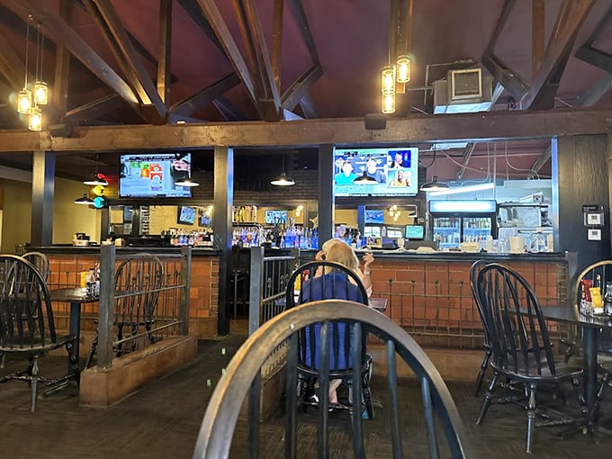 The dining room's warm wood and exposed beams create an atmosphere where conversations flow as freely as the drinks.