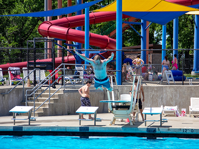 The diving board area: where ordinary humans briefly transform into Olympic hopefuls before gravity reminds them of their actual athletic abilities.