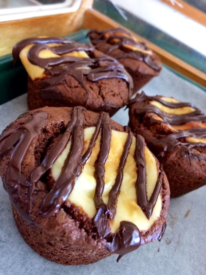 Chocolate muffins with cream centers and chocolate drizzle&mdash;because sometimes the answer to "Too much chocolate?" is "Not possible."