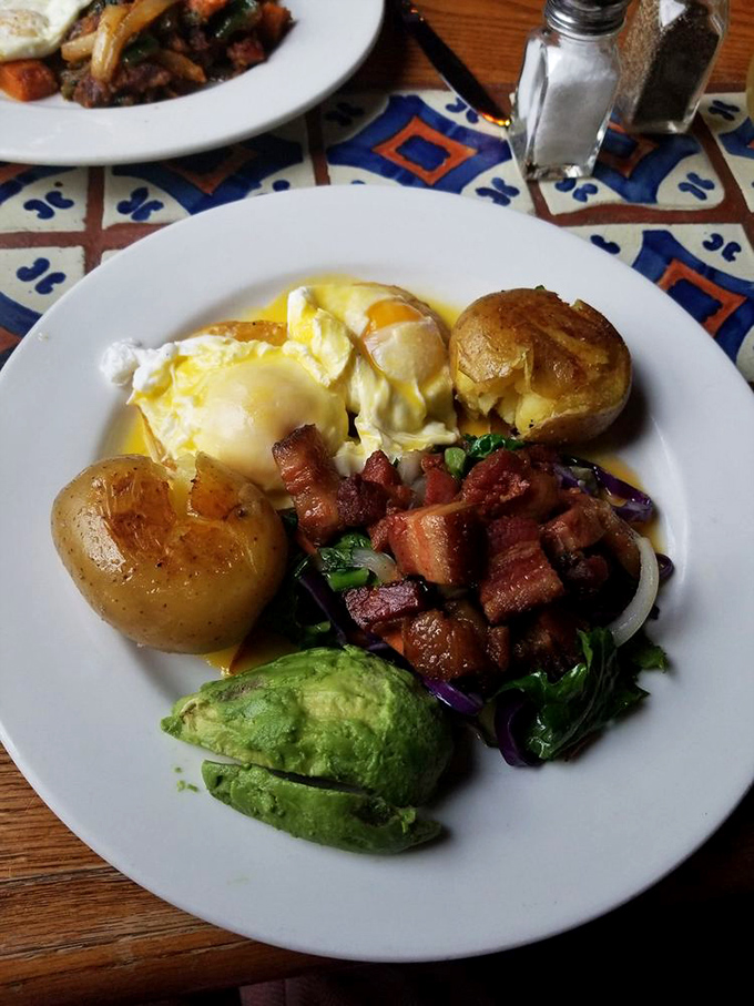 Eggs Benito with pork belly bacon and avocado is brunch nirvana. The hollandaise sauce pools like liquid sunshine, making Monday feel deliciously distant.
