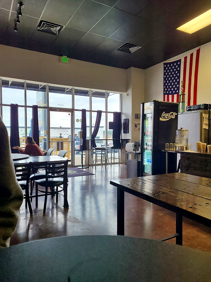 Sunlight streams through large windows, illuminating the American flag and creating that "I could stay here all day" ambiance.