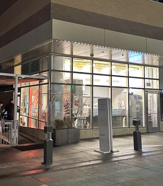 As evening falls, Pretty Bird glows like a beacon for spice-seekers. The illuminated storefront promises late-night satisfaction that's worth every minute in line.