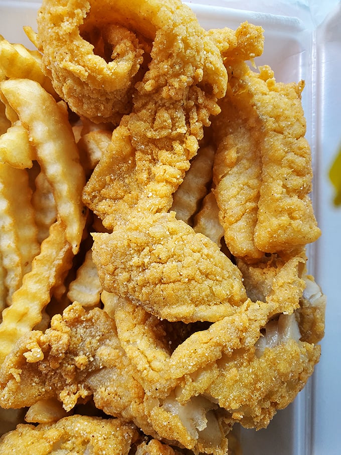 Fish so perfectly fried it shatters like glass at first bite, revealing the tender treasure within.