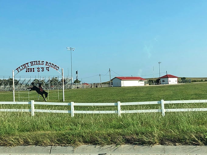 The Flint Hills Rodeo sign promises authentic cowboy action—no rhinestones or pretense, just genuine Kansas ranching culture on proud display.