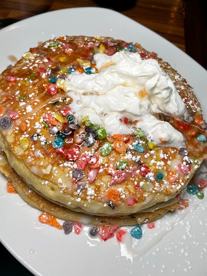 Fruity Pebble pancakes that would make Fred Flintstone weep with joy. Childhood nostalgia served hot with a side of whipped cream.