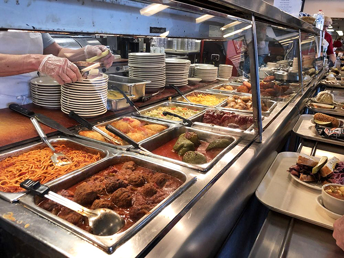 The hot food line presents a beautiful dilemma: stick with your sandwich plan or pivot to these tempting trays of home-style goodness?