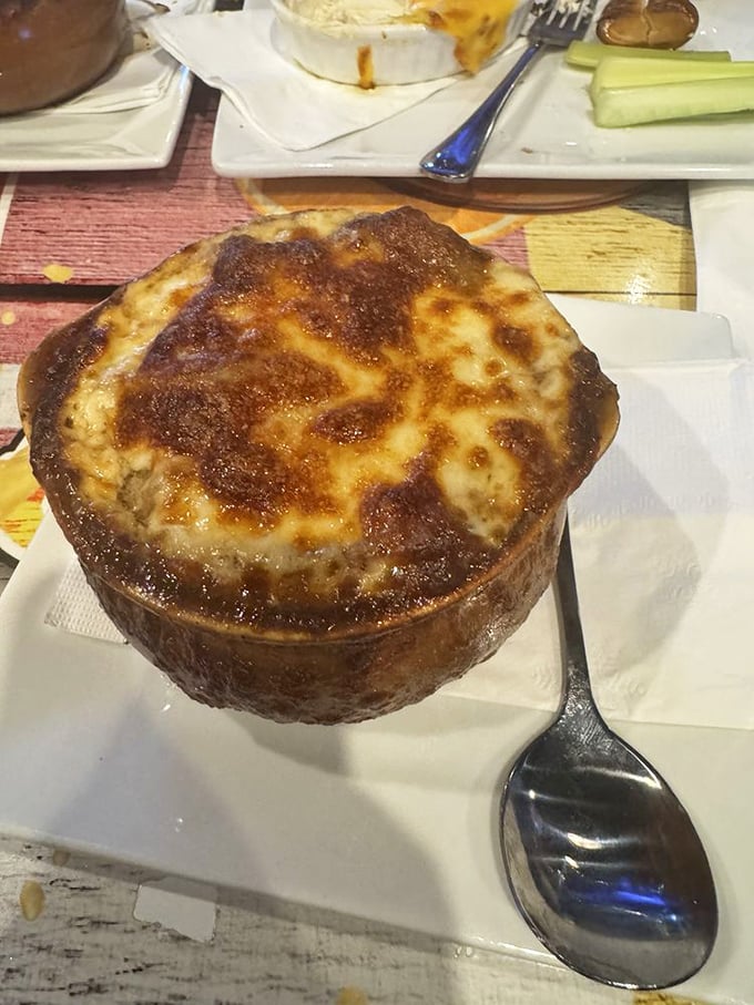 This French onion soup isn't playing games with its cheese cap. It's the edible equivalent of a warm blanket on a cold Maryland evening.