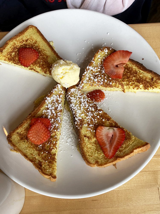 French toast that's dressed for success with strawberries and powdered sugar. Breakfast or dessert? The line blurs deliciously here.