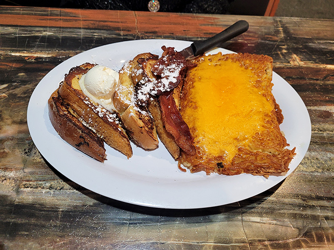 French toast elevated to art form, with butter melting like a sunrise over its golden-brown landscape. Powdered sugar adds the final masterful touch.