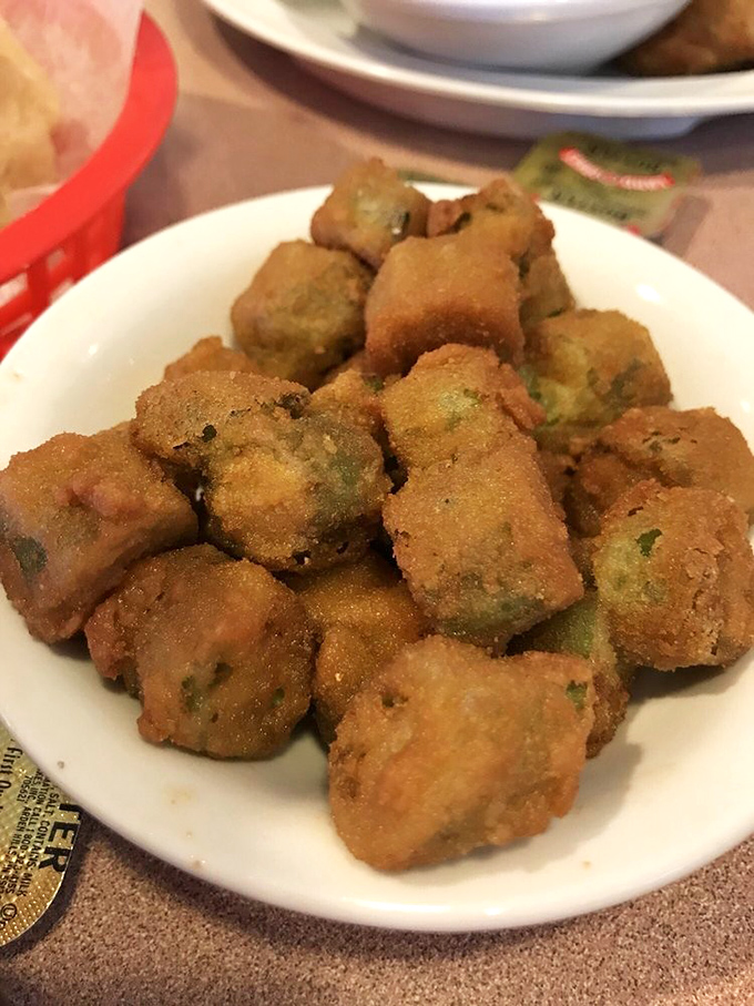 Fried okra &ndash; the South's answer to popcorn. These golden nuggets convert vegetable skeptics into true believers one crunchy bite at a time.