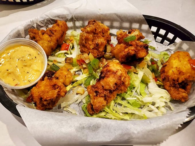 Fried oysters nestled on crisp lettuce like little seafood meteors that crashed onto the tastiest planet in the universe.