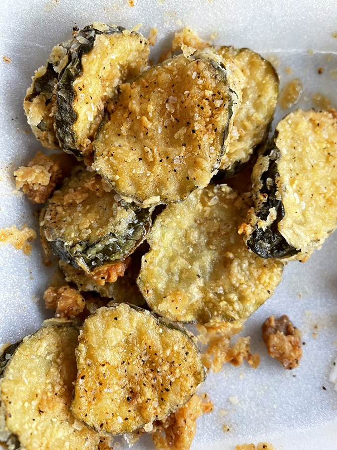 Fried pickles: the unsung heroes of barbecue sides. Crispy, tangy discs providing the perfect acidic counterpoint to hours of meat indulgence.