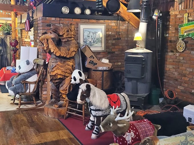 Leather booths curve invitingly against burgundy walls, creating intimate dining nooks where beef-centered memories are made.