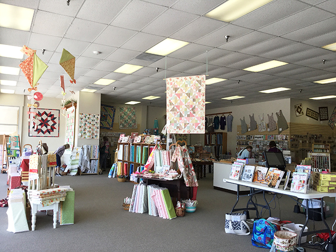 The shop floor&mdash;a textile playground where quilting novices and veterans alike navigate islands of inspiration under the watchful eye of hanging samples.
