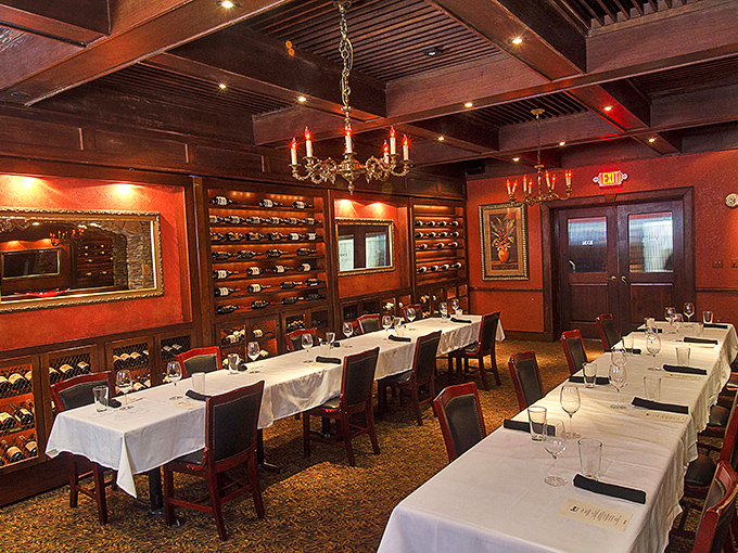 Wine walls and white tablecloths. This elegant dining room with its rich wood accents whispers, "Your diet starts tomorrow."