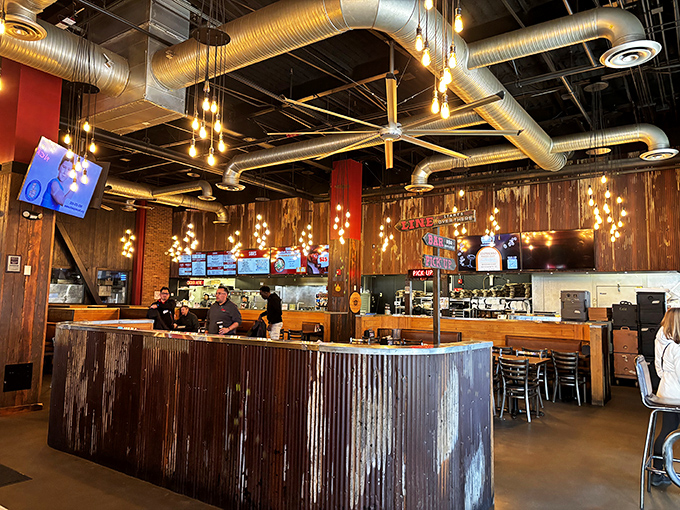 Industrial pipes meet warm wood and Edison bulbs—the perfect backdrop for the serious art of meat appreciation.