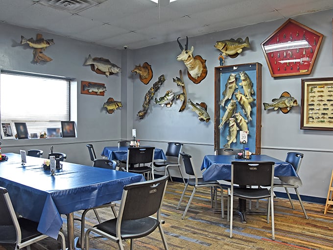 Fish mounts and blue tablecloths create a distinctly Kentucky dining room where hunting stories and barbecue opinions flow as freely as the sweet tea.