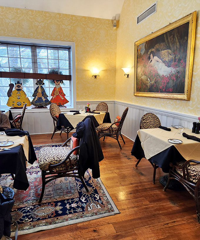 A quieter dining room with warm yellow walls and animal-themed decor. The perfect setting for an intimate meal with fascinating conversation.