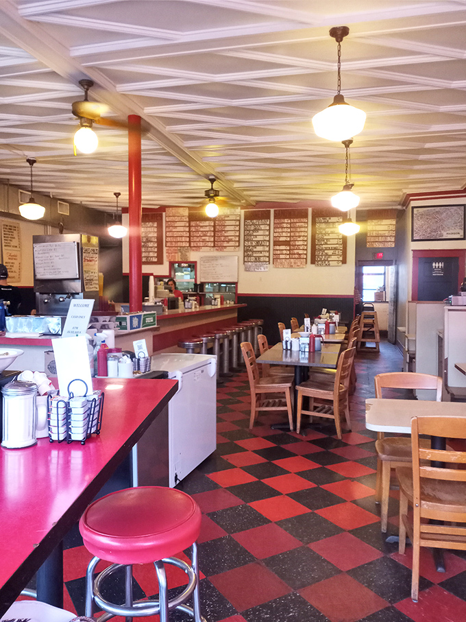 Classic diner stools await their next patrons, each one having supported decades of satisfied customers and their temporarily expanded waistlines.