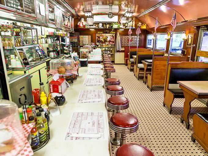 Looking down the length of this classic diner car feels like peering into America's culinary soul—complete with counter, booths, and endless coffee.