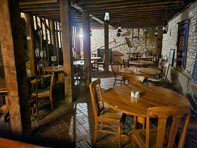 Original limestone walls and wooden beams whisper tales of 1800s travelers while modern diners create new memories over plates of comfort food.