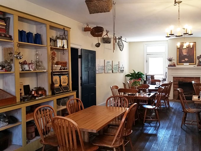Wooden shelves lined with historical treasures frame this dining room where modern meals are served with two centuries of hospitality experience.