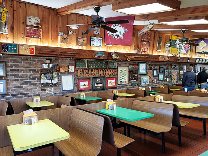 Wood paneling, Razorback flags, and colorful tables create the perfect stage for burger theater. Comfort in every corner.