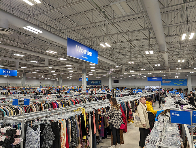 The women's section stretches toward the horizon like a sea of fashion possibilities. Clear signage makes navigating this textile ocean surprisingly manageable.
