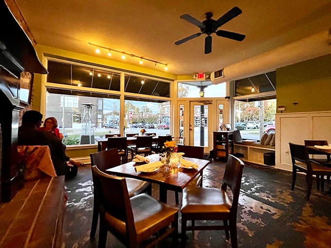 Large windows flood the dining space with natural light, creating the perfect ambiance for morning coffee contemplation or afternoon catch-ups.