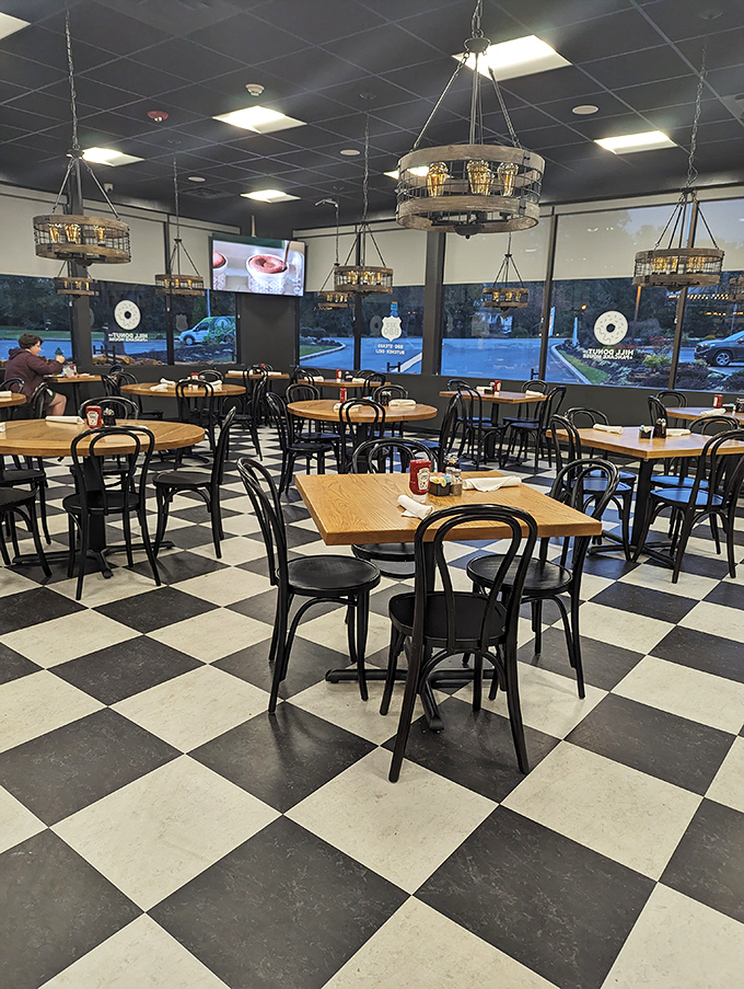 Empty tables never looked so full of possibility. Each circular light fixture promises to illuminate your impending food euphoria.