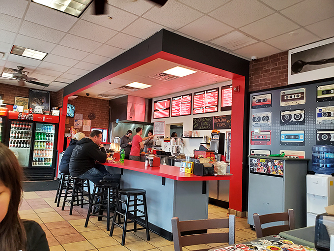 The nostalgic interior balances retro charm with modern cleanliness. Those cassette tapes on the wall? Younger diners might need explanation.