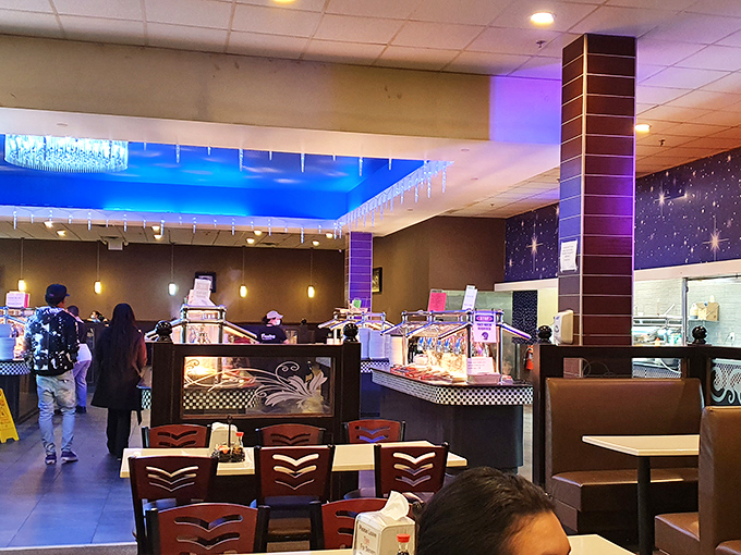 The interior design features cosmic-inspired walls and elegant lighting, creating an unexpectedly sophisticated atmosphere for your all-you-can-eat adventure.