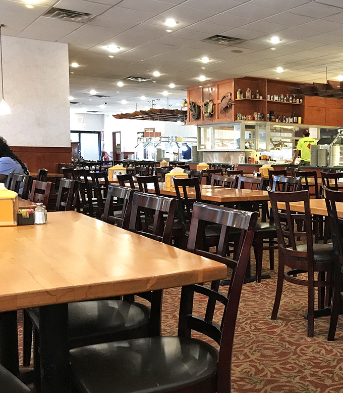 The dining room's wooden tables and patterned carpet create that perfect "come as you are" atmosphere where elastic waistbands are always welcome.