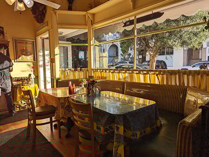 Yellow walls and warm wood create the perfect backdrop for morning memories. Cozy enough to make leaving a genuine challenge.