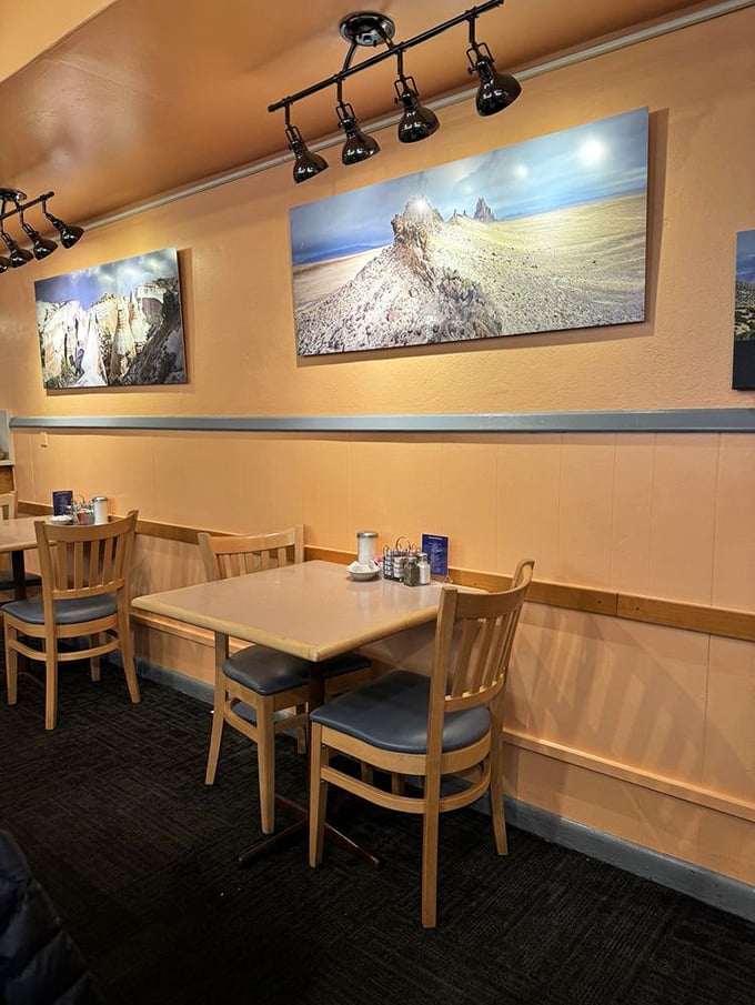 Cozy booths beneath stunning landscape photography—because good food deserves good scenery, even when you're indoors.