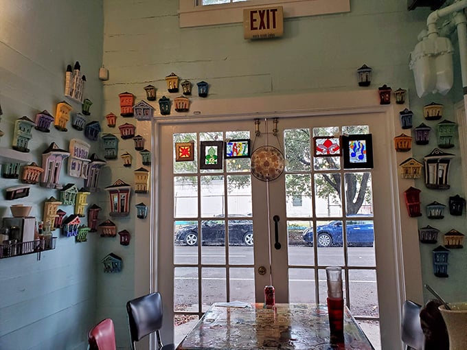 Colorful tiny houses line the walls like a miniature neighborhood, watching over diners as they embark on their breakfast adventures.