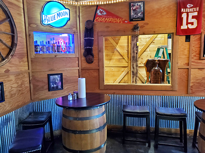 Barrel tables and wood-paneled walls create the kind of authentic country charm no corporate restaurant designer could ever truly replicate.