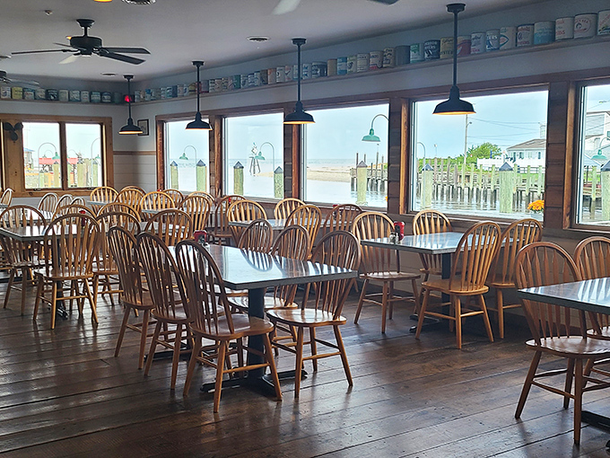 Rows of Windsor chairs face panoramic windows, ensuring every seat offers a water view that pairs perfectly with whatever's on your plate.