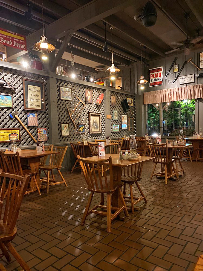 Empty tables waiting for their next guests. The lattice walls adorned with memorabilia create the perfect backdrop for memories in the making.