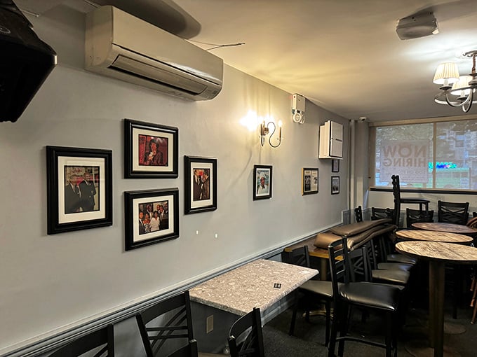 The walls tell stories through framed memories, while the exposed brick adds warmth to a room that's witnessed countless celebrations and everyday meals.