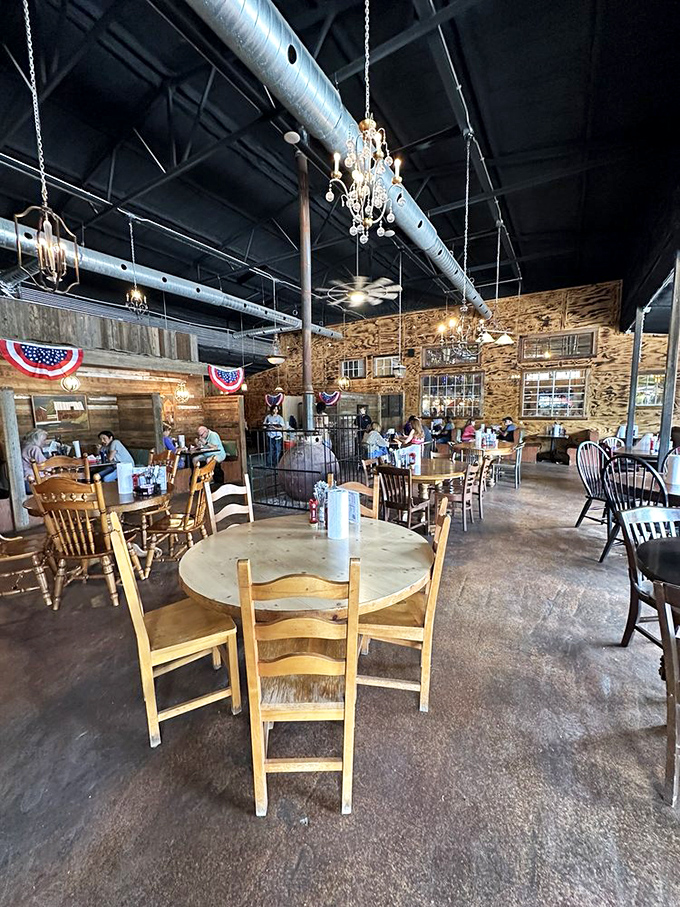 Chandeliers hanging from industrial ceilings create an unexpected elegance in this temple of fried chicken devotion.