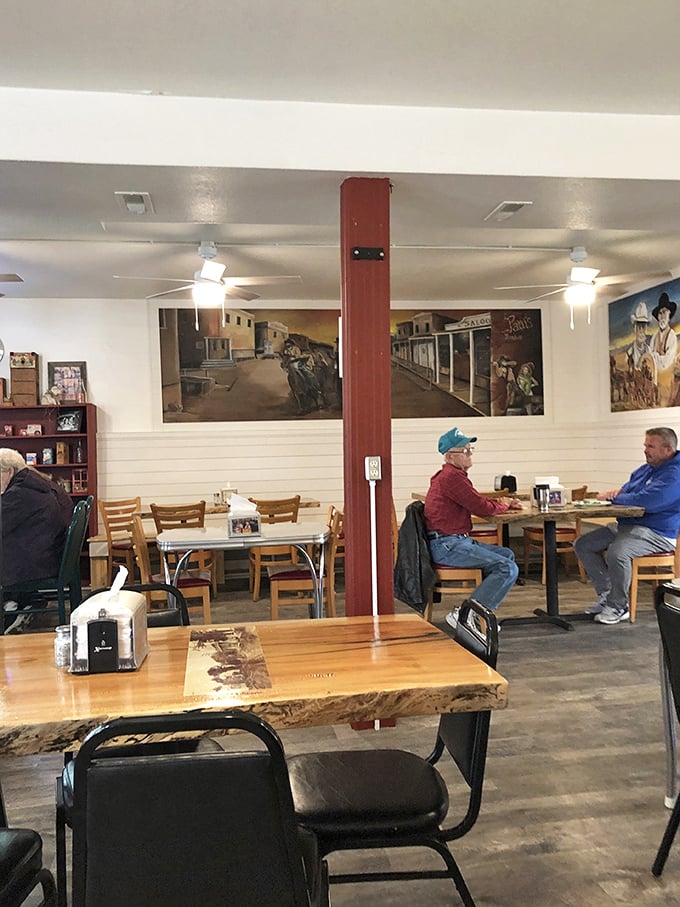 Western-themed murals watch over diners like friendly ghosts, adding a touch of Kansas heritage to every meal.