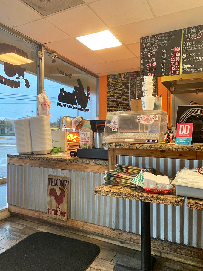 The menu boards dominate the wall like sacred texts, promising poultry pleasures in portions from modest to magnificent.