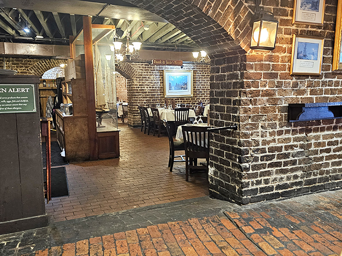 Brick pathways lead you through dining rooms where every table feels like the best seat in the house.