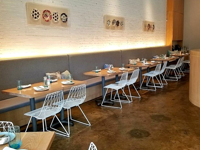 Clean lines, geometric chairs, and thoughtful lighting create a dining room that feels both timeless and thoroughly modern&mdash;comfort without compromise.