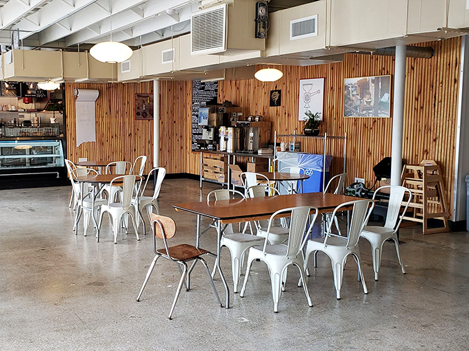 Wood-paneled walls and industrial chairs create a warm, inviting space. No distractions from the serious business of enjoying exceptional food.